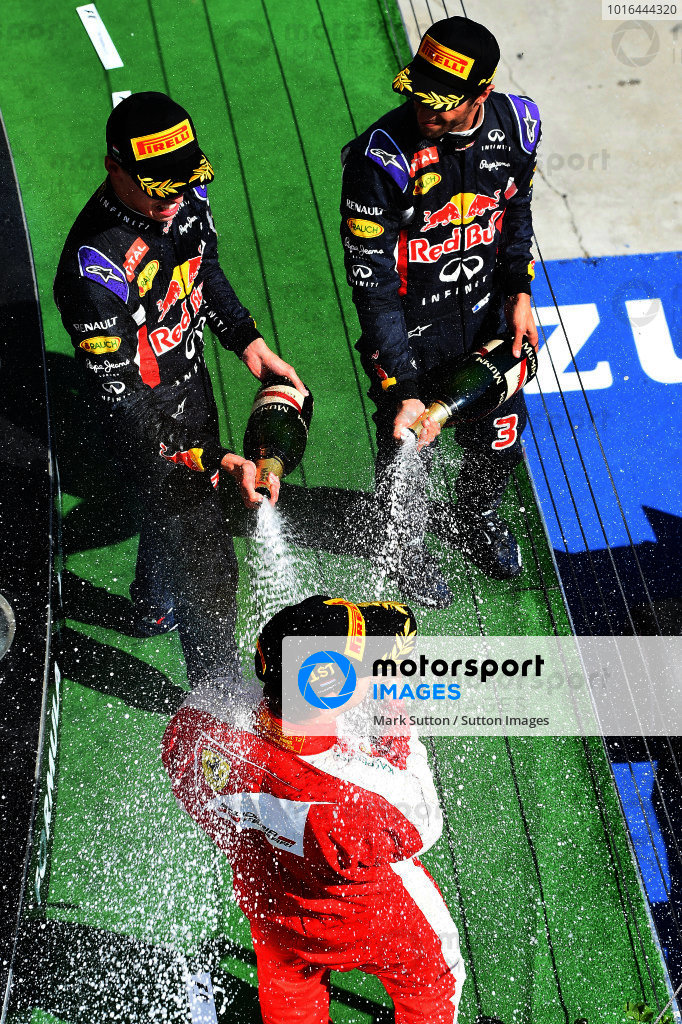 Race winner Sebastian Vettel (GER) Ferrari, drcip and Daniil Kvyat (RUS ...
